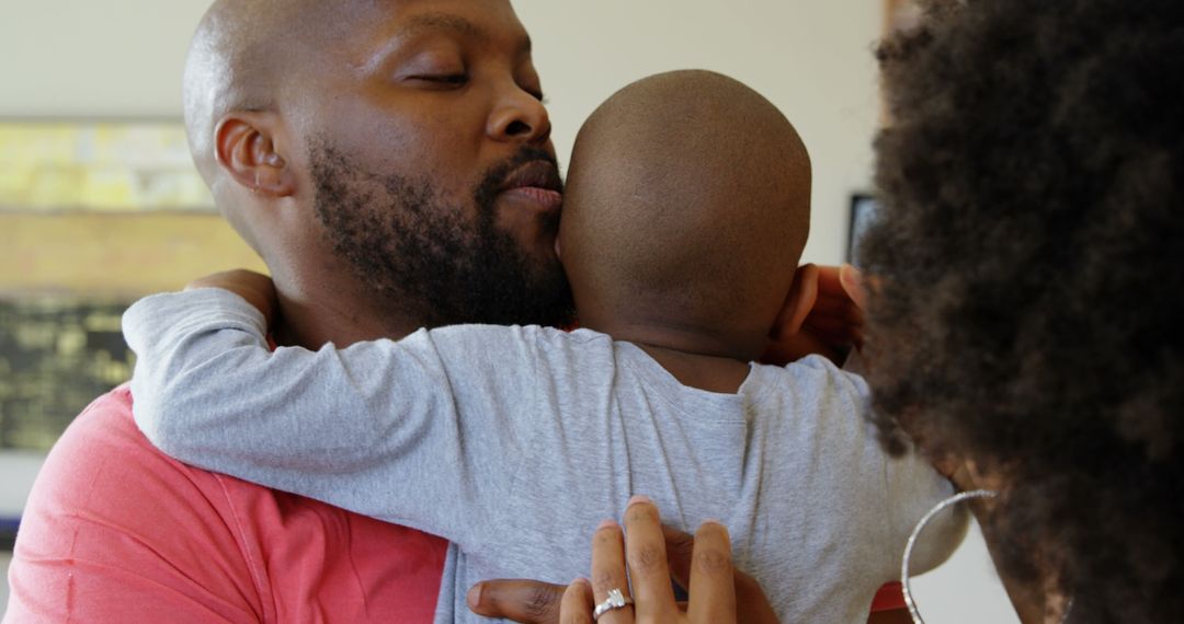 Loving parents comforting their child at home - Free Stock Photo | Pikwizard