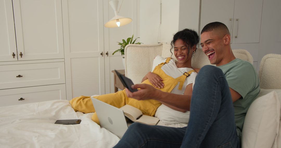 Relaxed Couple Enjoys Laptop Entertainment at Home - Free Stock Photo ...