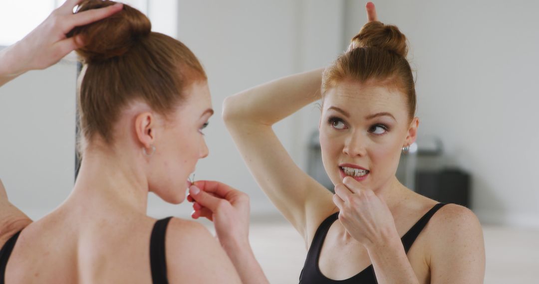 Ballet Dancer Preparing Hair in Mirror Reflection - Free Stock Photo ...