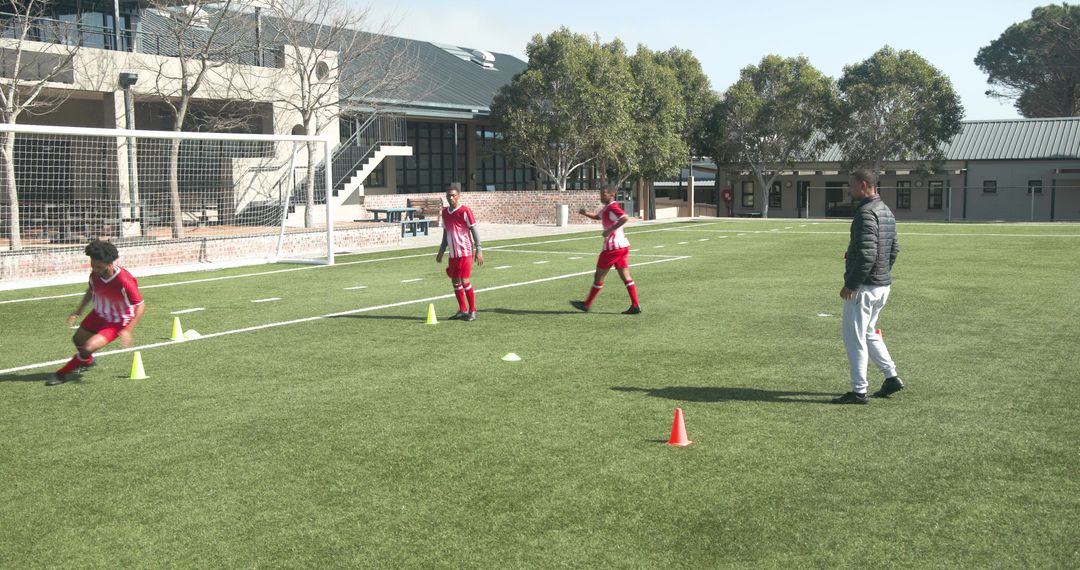 Teen Soccer Players Practicing Footwork Drills with Coach on Field ...