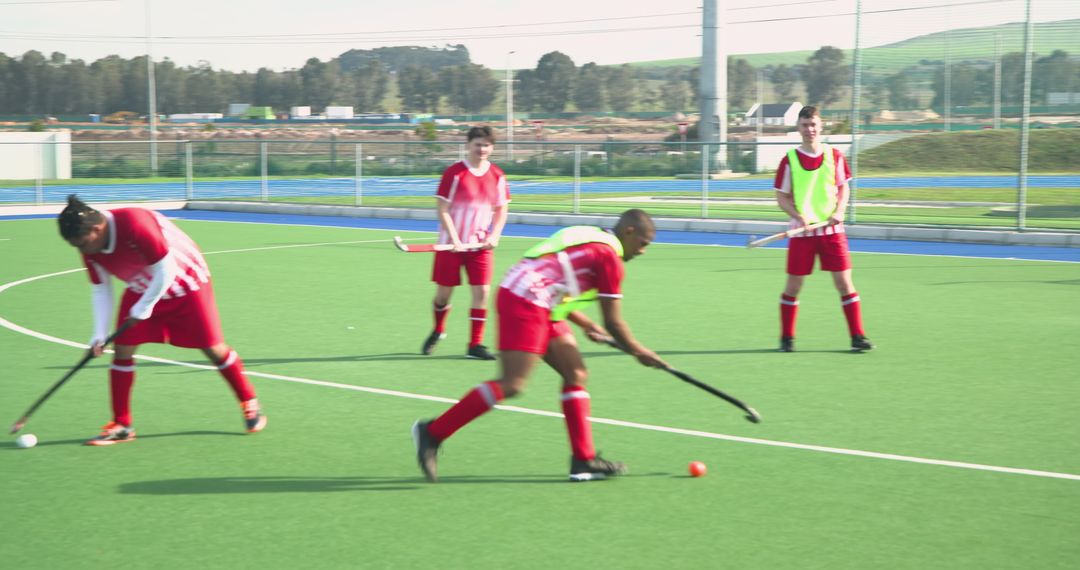 Hockey Players Practicing on Outdoor Field - Free Stock Photo | Pikwizard