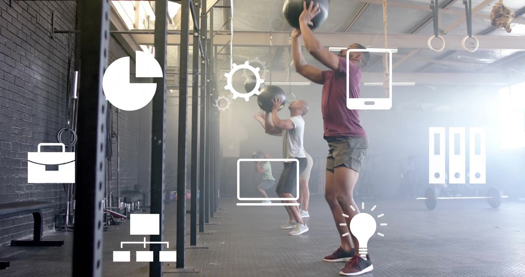 Athletes Using Medicine Balls for Intense Wall Throws in Industrial Gym ...