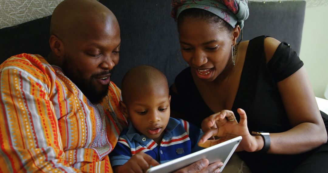 Happy african american family using tablet together at home - Free ...