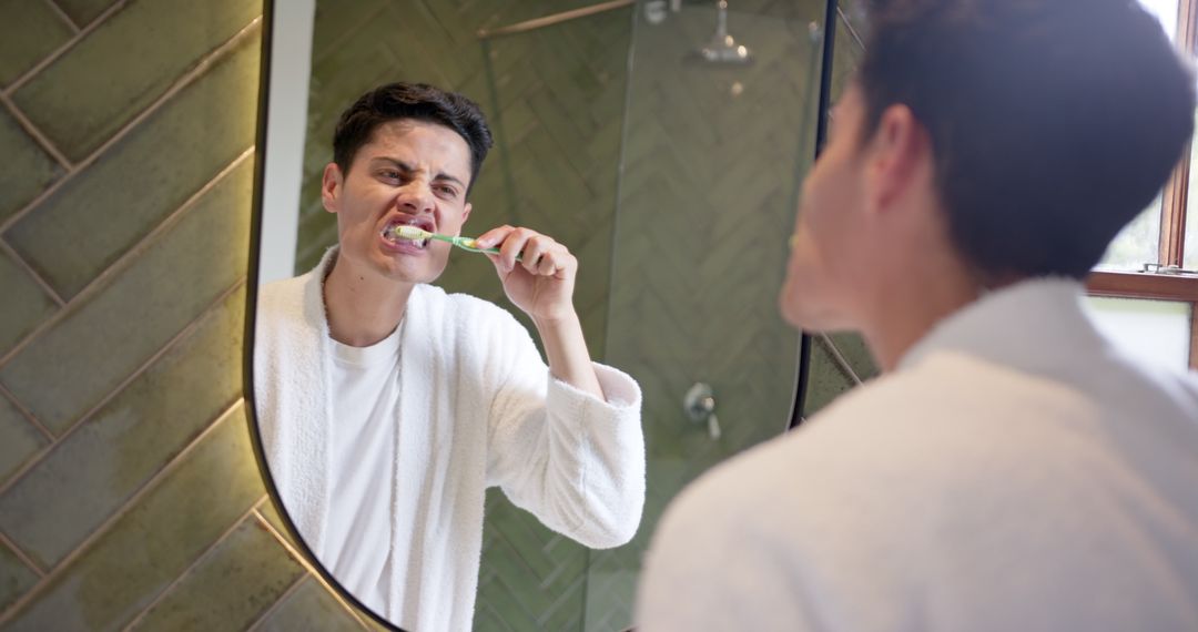 Person Brushing Teeth in Bathroom for Morning Routine - Free Stock ...