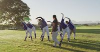 Female Baseball Team Engaging in Pre-game Warm-up Stretching - Download ...