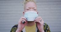 Man with Albinism Wearing Face Mask in Urban Setting - Download Free ...