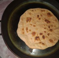 Close up of Rustic Roti Cooking on Hot Skillet - Download Free Image ...