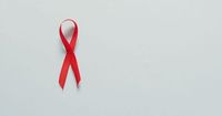 Red Blood Cancer Awareness Ribbon Symbol on Light Blue Background ...
