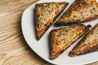 Crispy Whole Grain Toast Triangles on White Plate from Pikwizard