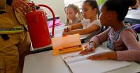 Firefighter Conducting Fire Safety Lesson in Classroom - Download Free ...