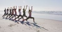 Group Doing Yoga Poses on Beach With Ocean View - Download Free Image ...