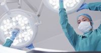Surgeon Adjusting Operating Room Lights During Surgery from Pikwizard