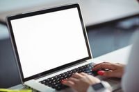 Close-Up of Individual Typing on Laptop with Blank Screen - Download ...