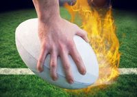 Rugby Ball on Fire Held by Hand on Field - Download Free Image from ...