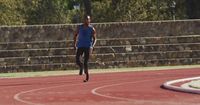 Determined Athlete Running on Track with Blade Prosthetic - Download ...