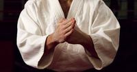 Karate Practitioner in Close-Up Gi Grip Stance at Dojo - Download Free ...